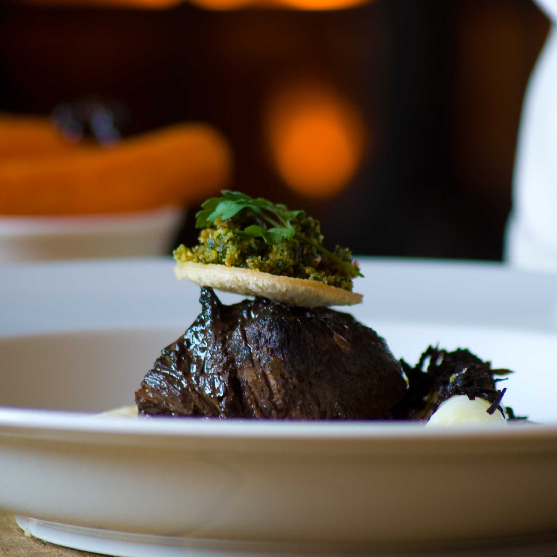 Beef cheeks, bone marrow on toast, white vegetable puree, red wine ...